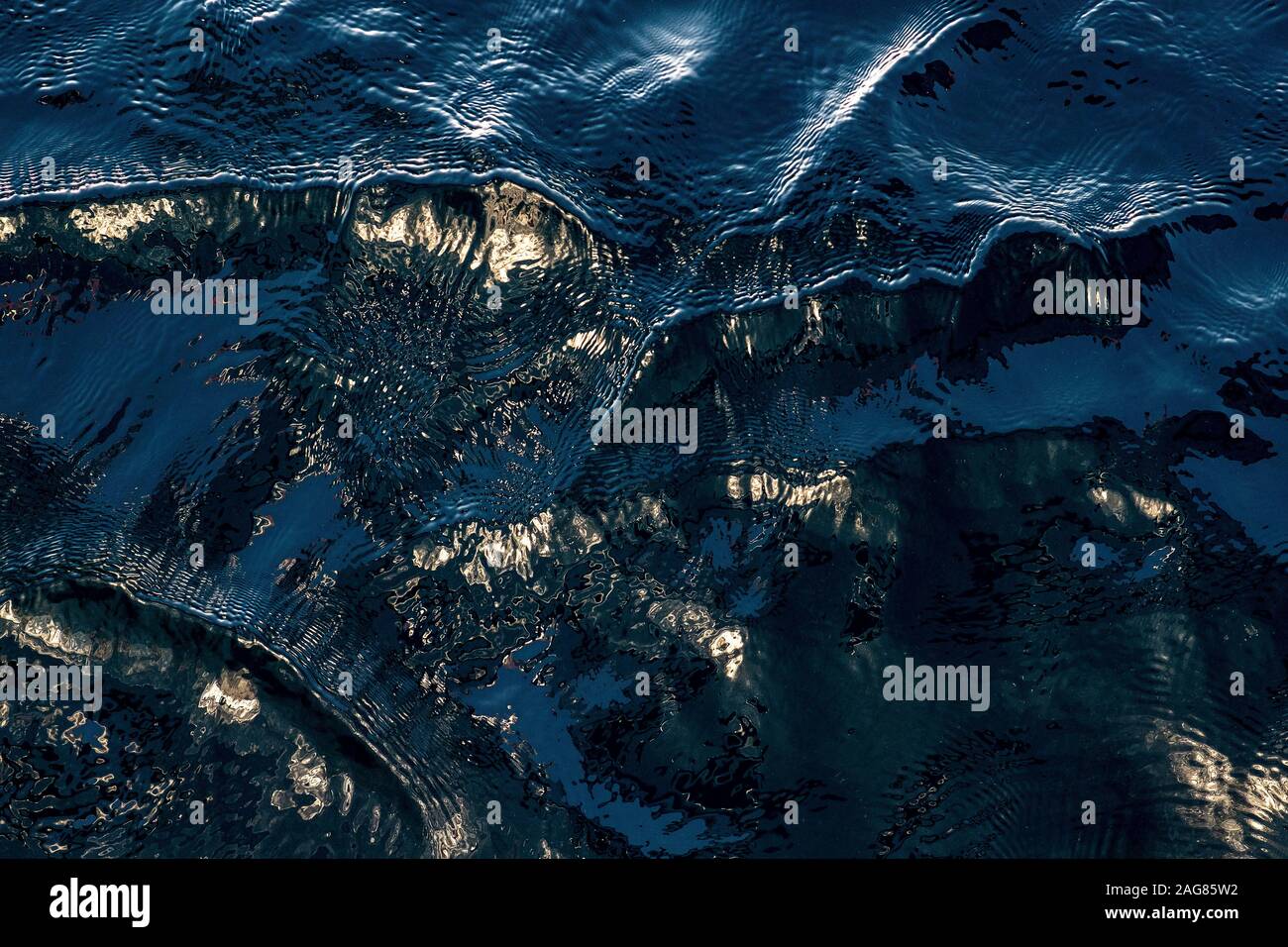 Blue sea water background gentle waves Stock Photo - Alamy