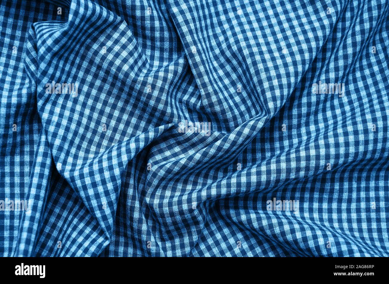 texture of checkered fabric pattern background toned classic blue color ...