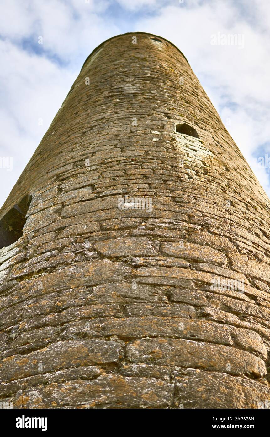 Medieval ruins of a temple build of limestone. Stone tower above place ...