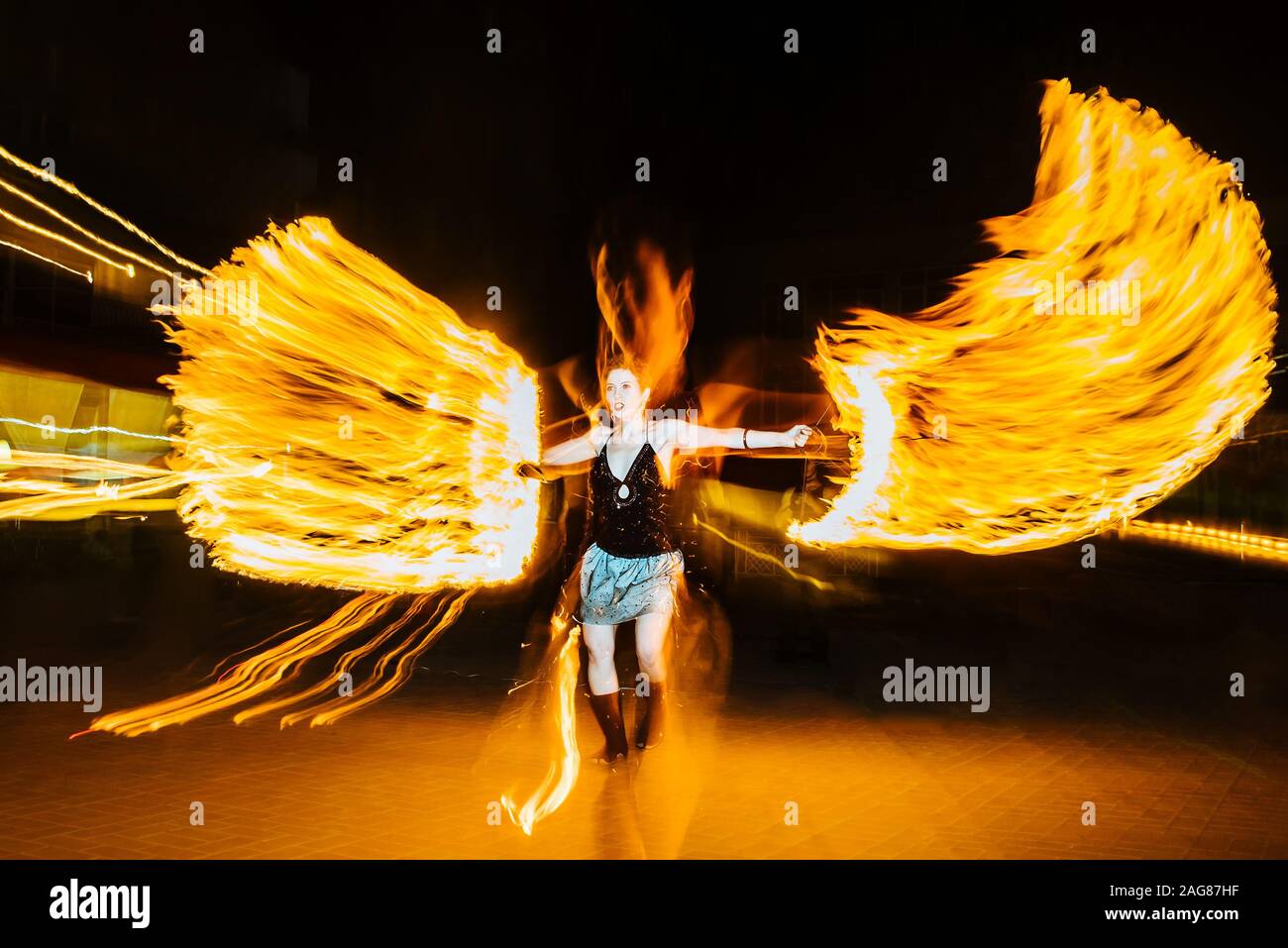 girl with fiery wings performs at night Stock Photo - Alamy