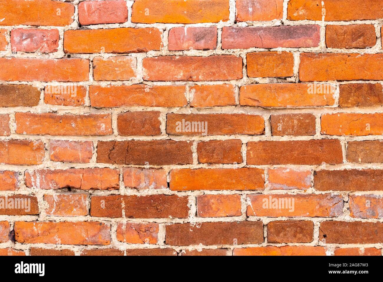 Background of old red stone wall. Texture of brick Stock Photo - Alamy