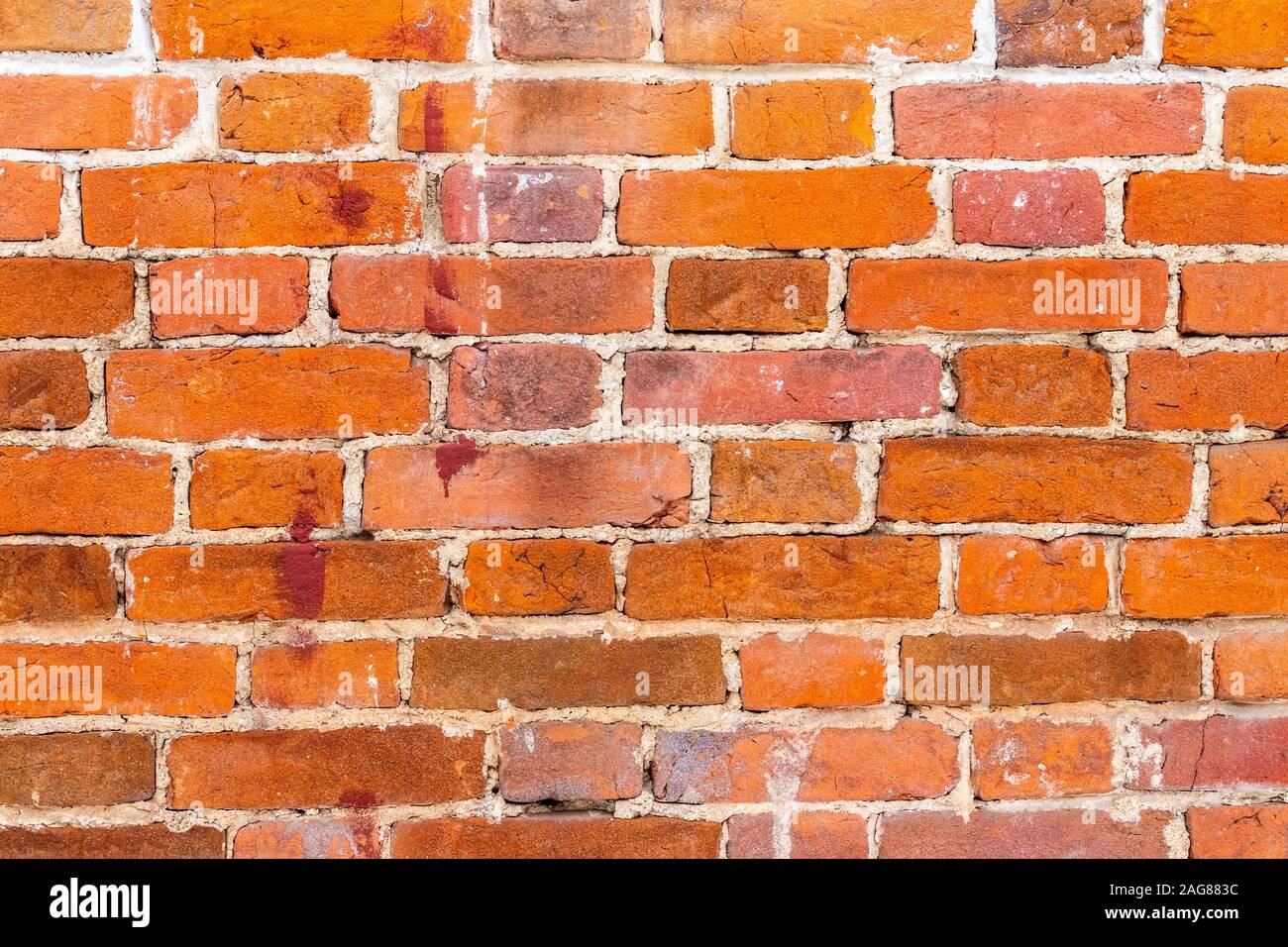 Background of old red stone wall. Texture of brick Stock Photo - Alamy