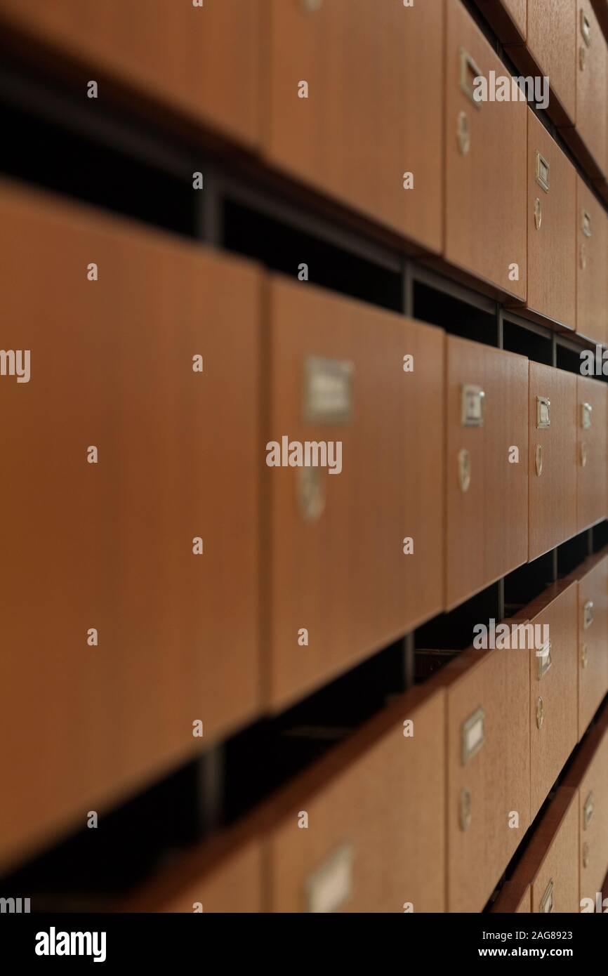 Vertical shot of lines of small wooden lockers - perfect for an article ...