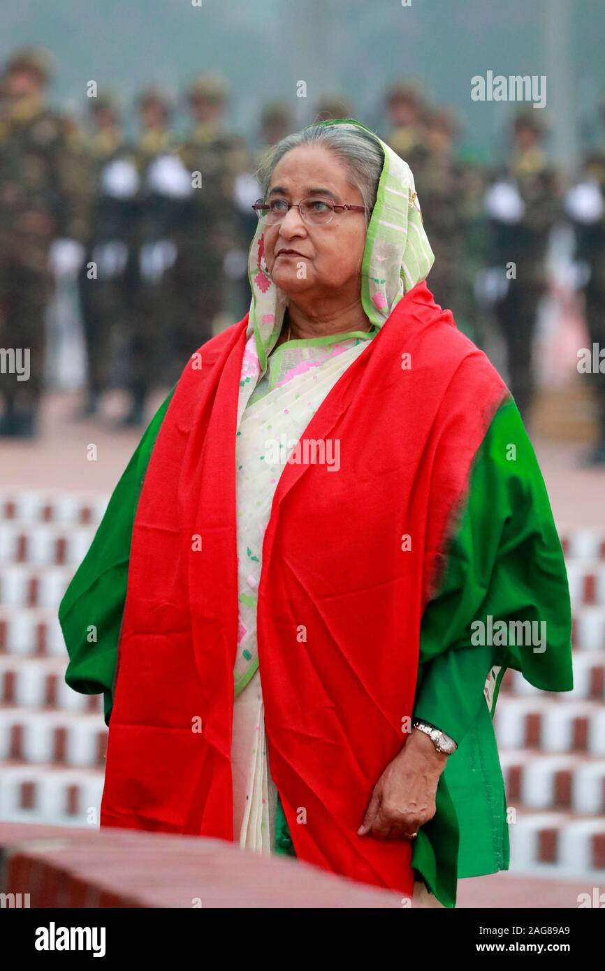 Dhaka, Bangladesh - December 16, 2019: Prime Minister Sheikh Hasina places a wreath as stands in ...