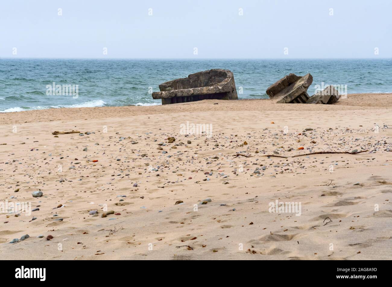 construction debris on the shore, concrete structures on the beach ...