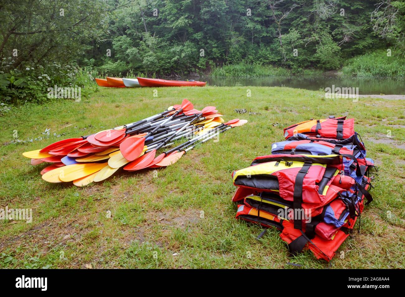 kayaks paddles life jackets, items for kayaking Stock Photo - Alamy