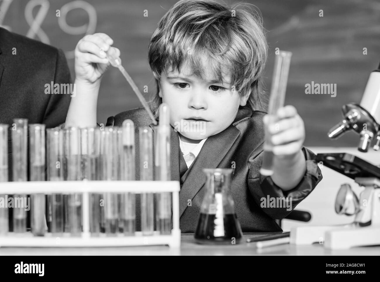 Child lab coat test tube Black and White Stock Photos & Images - Alamy