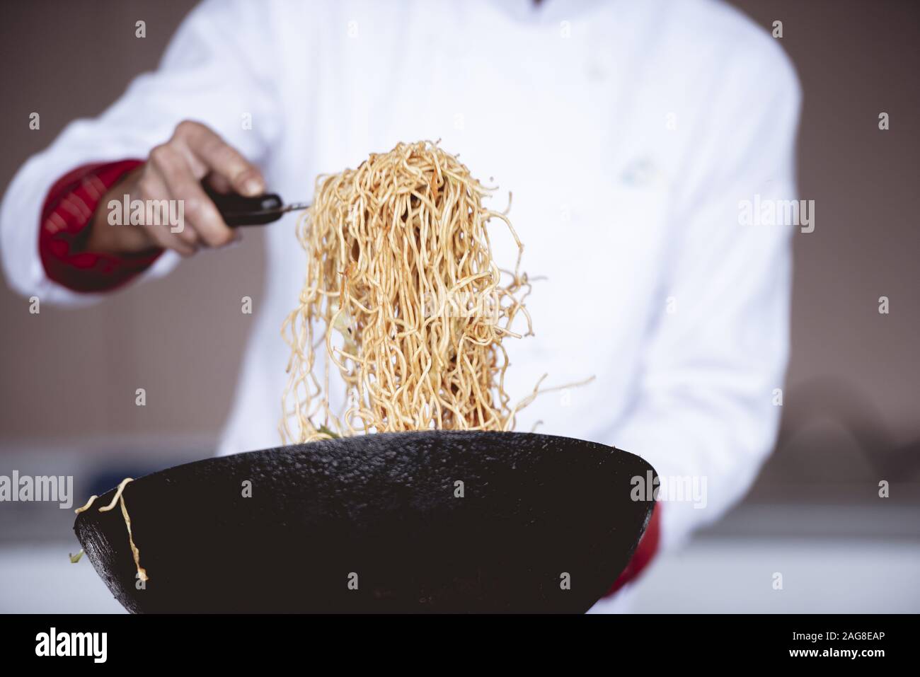 Cuisine man young cook noodles hi-res stock photography and images - Alamy