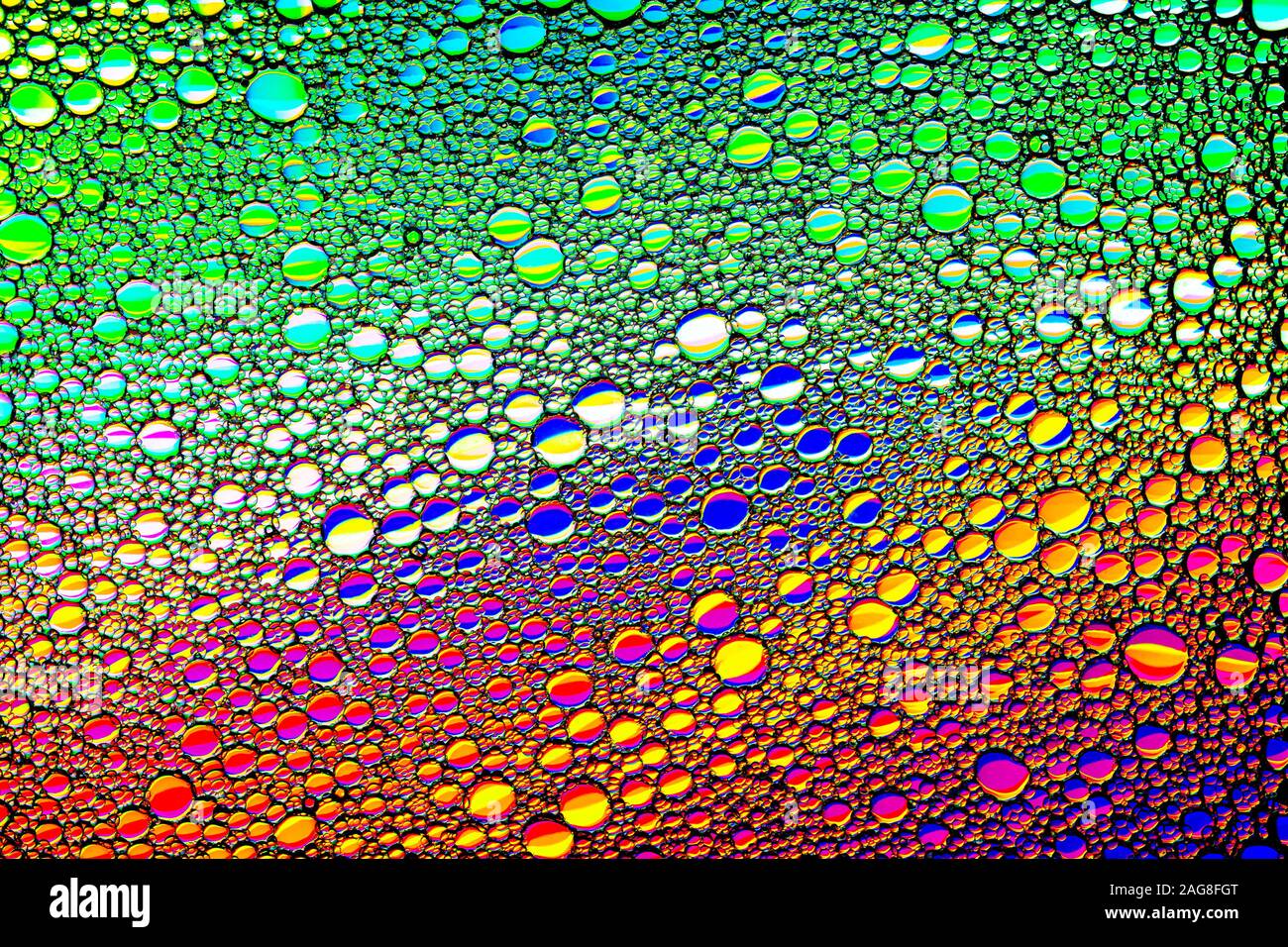 Colorful drops of oil on the water. Circles and ovals. Abstract bright ...