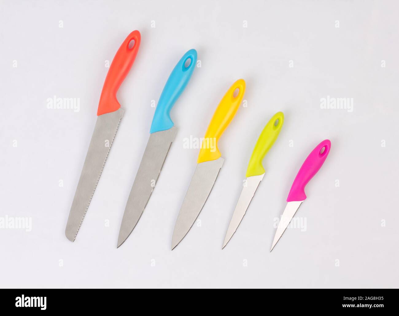 A group of colorful kitchen knifes isolated on white background Stock ...