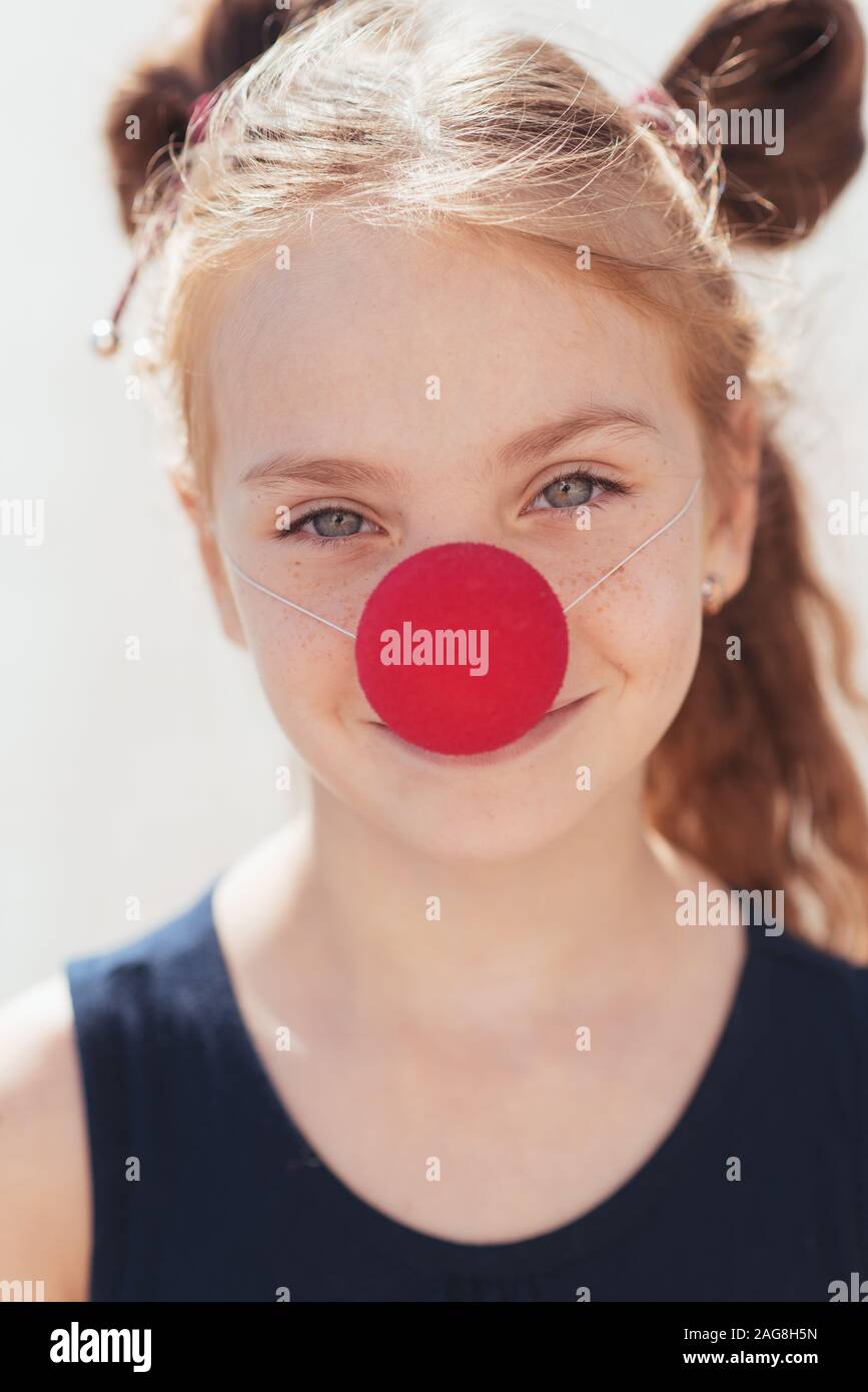 portrait of a little girl with a clown nose Stock Photo - Alamy