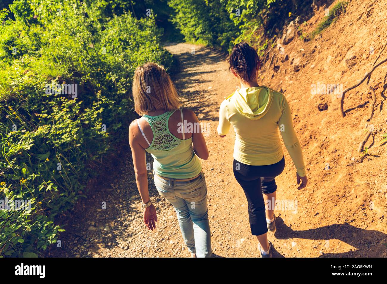 Two girls walking together hi-res stock photography and images - Alamy