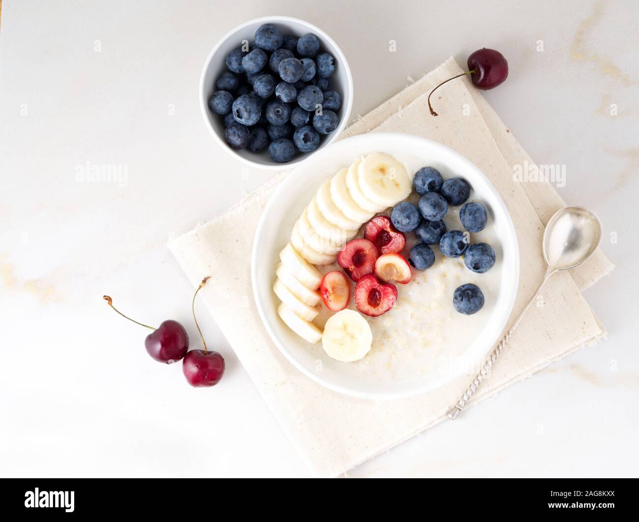 Large bowl of tasty and healthy oatmeal with a fruits and berry for ...