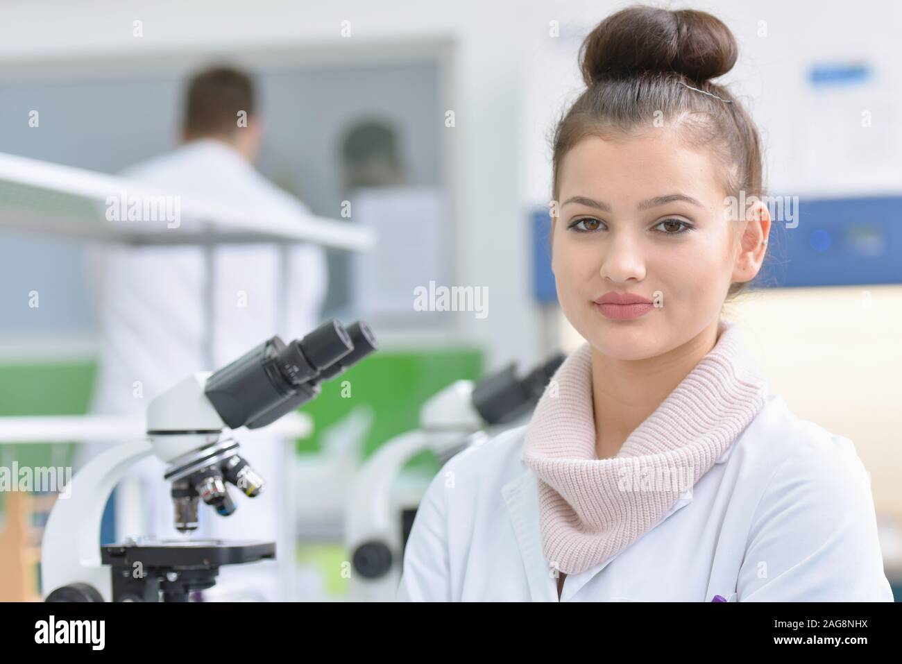 Group of young Laboratory scientists working at lab with test tubes and ...