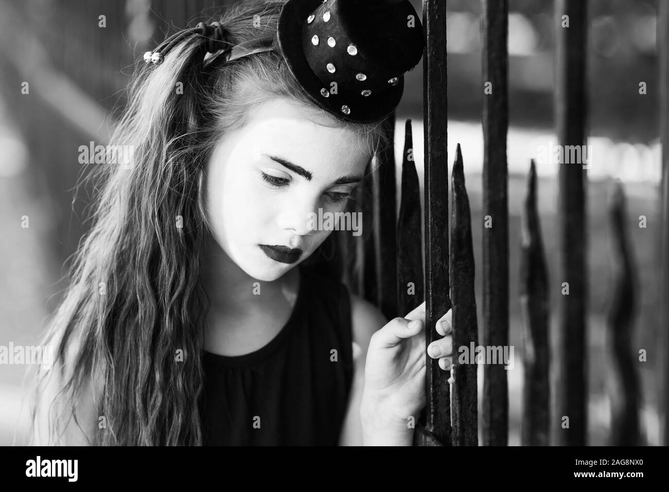 little mime girl standing by the fence Stock Photo - Alamy