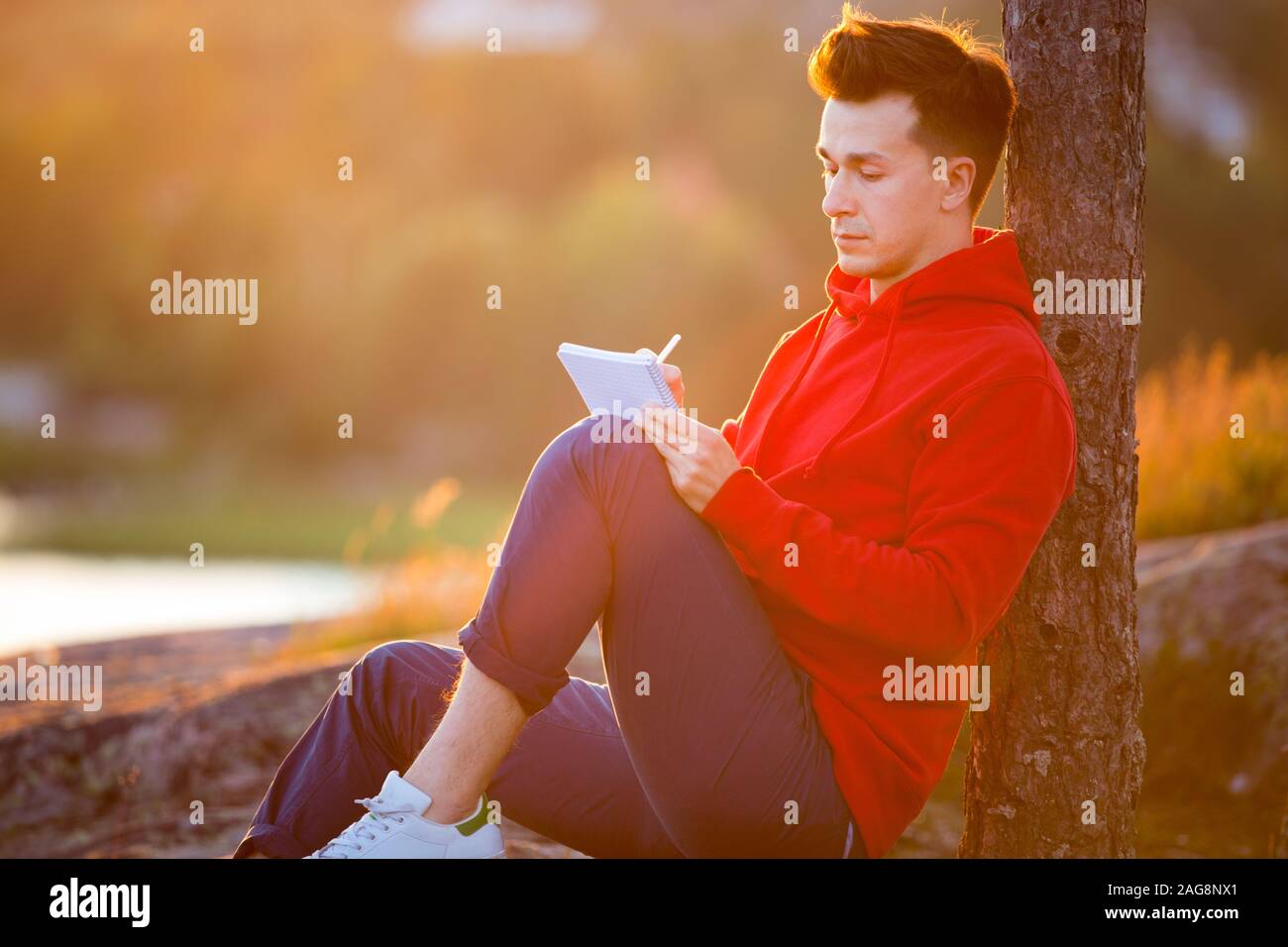 Man write book outdoor hi-res stock photography and images - Alamy