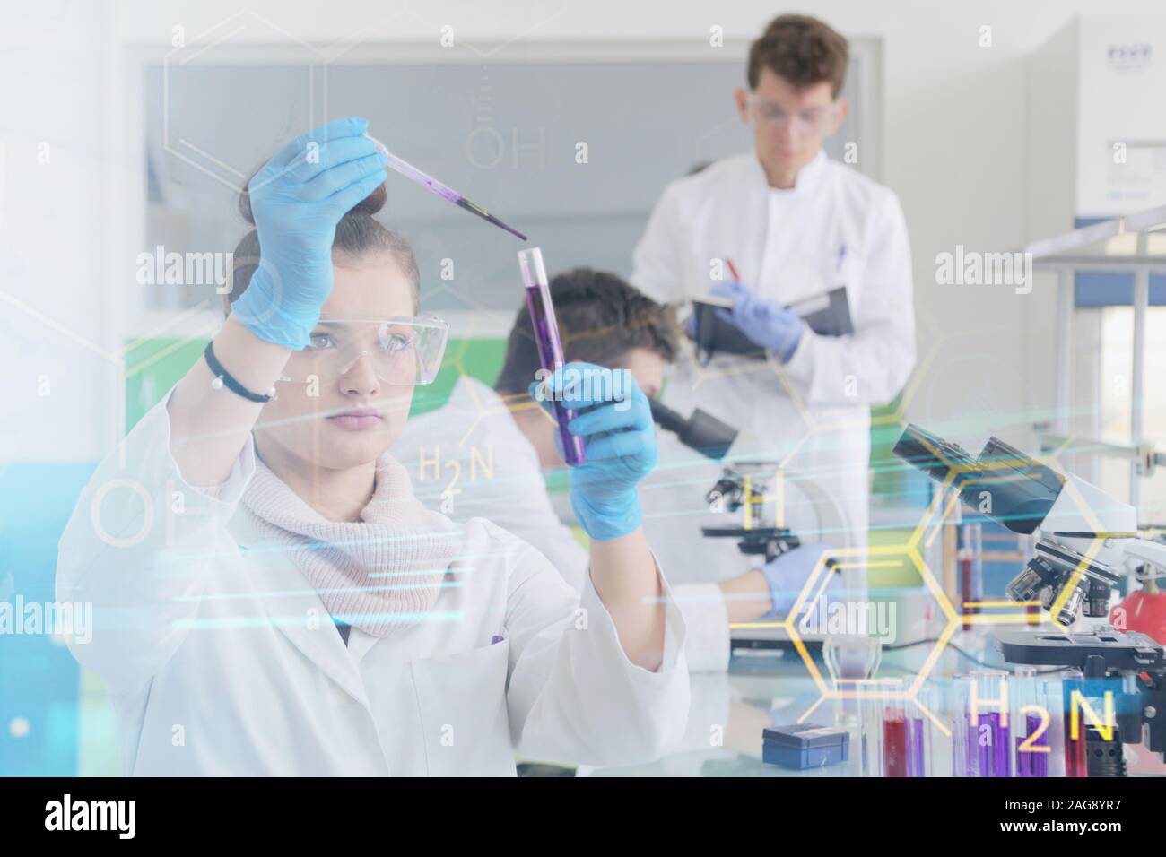 Group of young Laboratory scientists working at lab with test tubes and ...