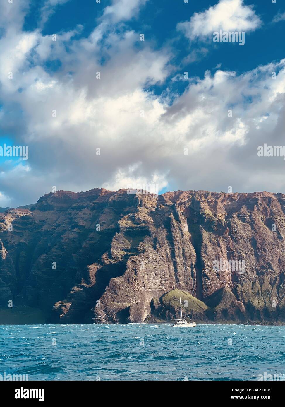 Vertical shot of the breathtaking view of the cliffs over the ocean ...