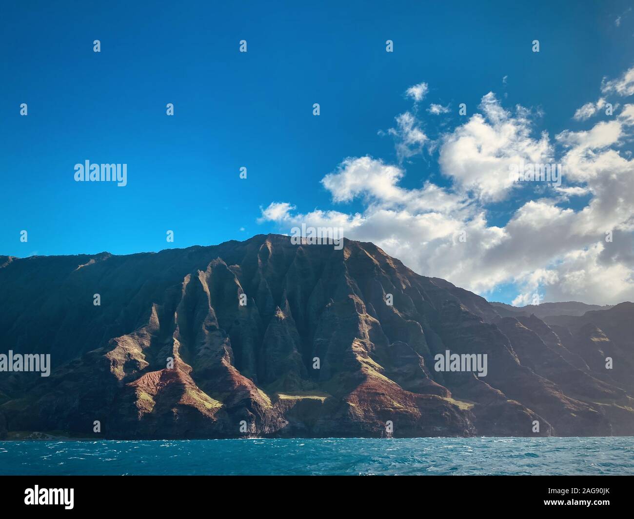 Breathtaking view of the mountain cliffs over the ocean under the ...