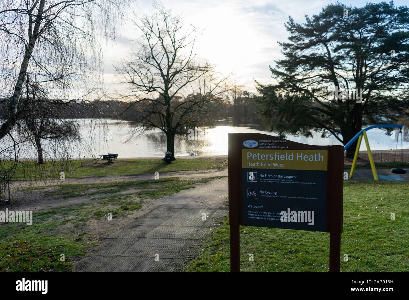 The sign For Petersfield Heath with Petersfield lake in the background ...