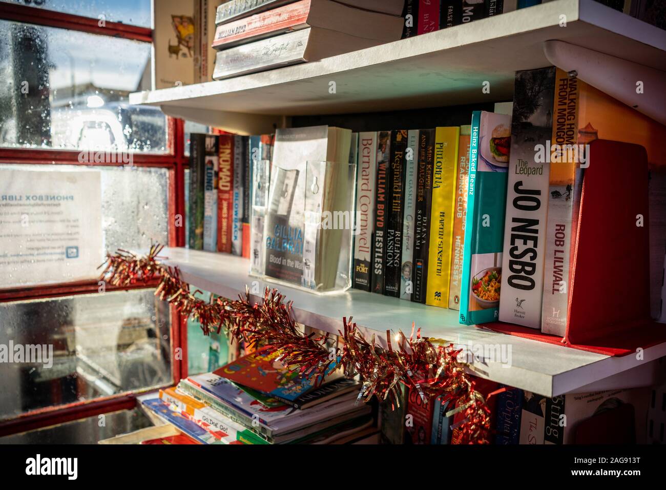 Inside of an old Red British phone box now being used as a library as a ...