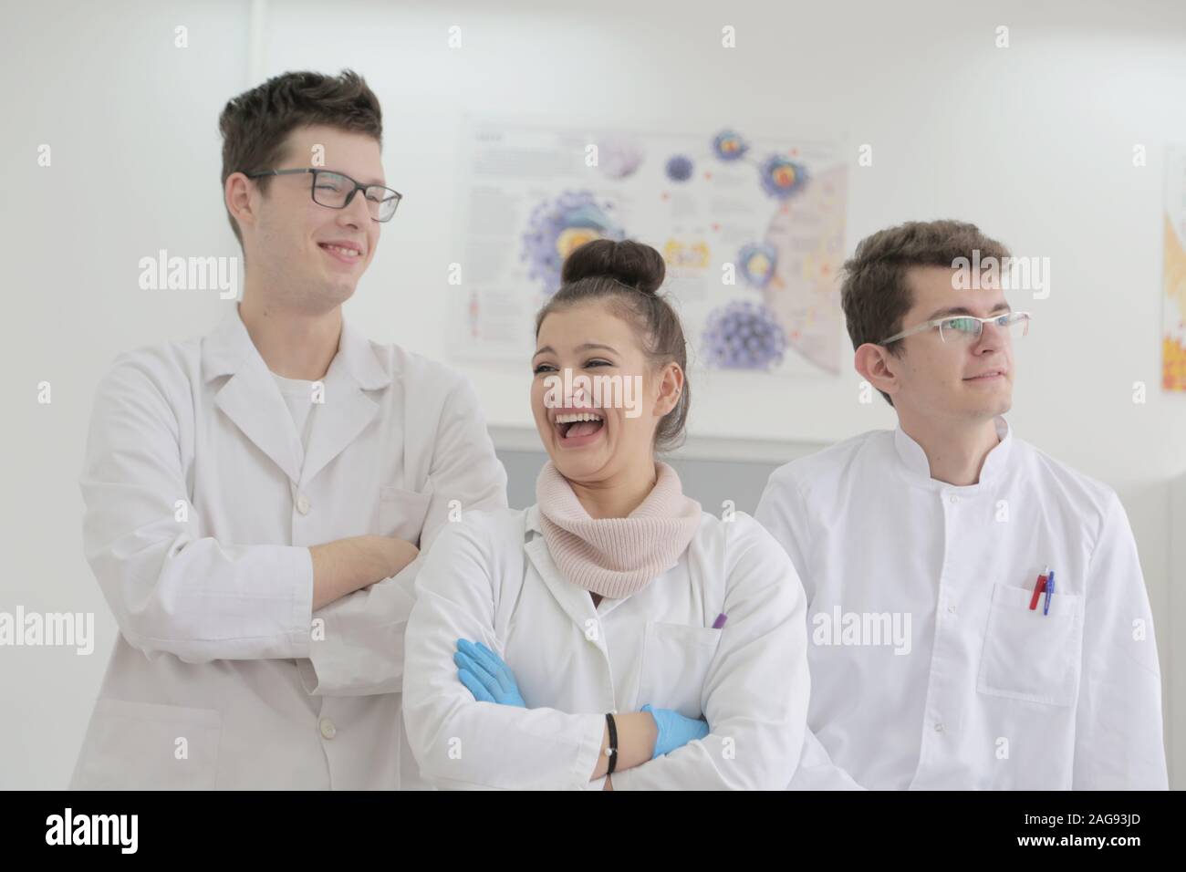 Group of young Laboratory scientists working at lab with test tubes and ...