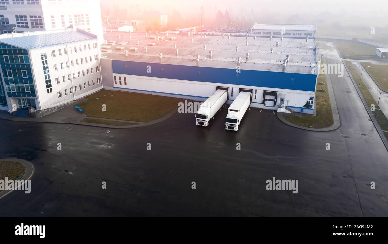 trucks are loaded in the logistics center top view Stock Photo - Alamy