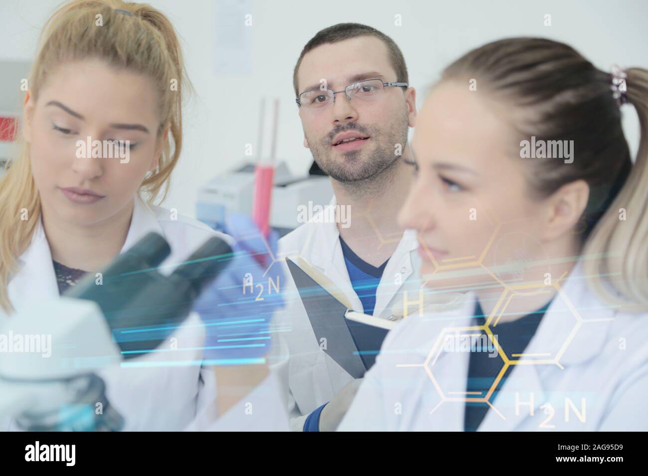 Group of young Laboratory scientists working at lab with test tubes and ...