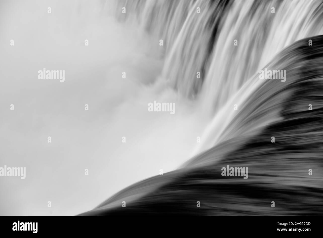 Grayscale high angle shot of the foamy water of a waterfall Stock Photo ...