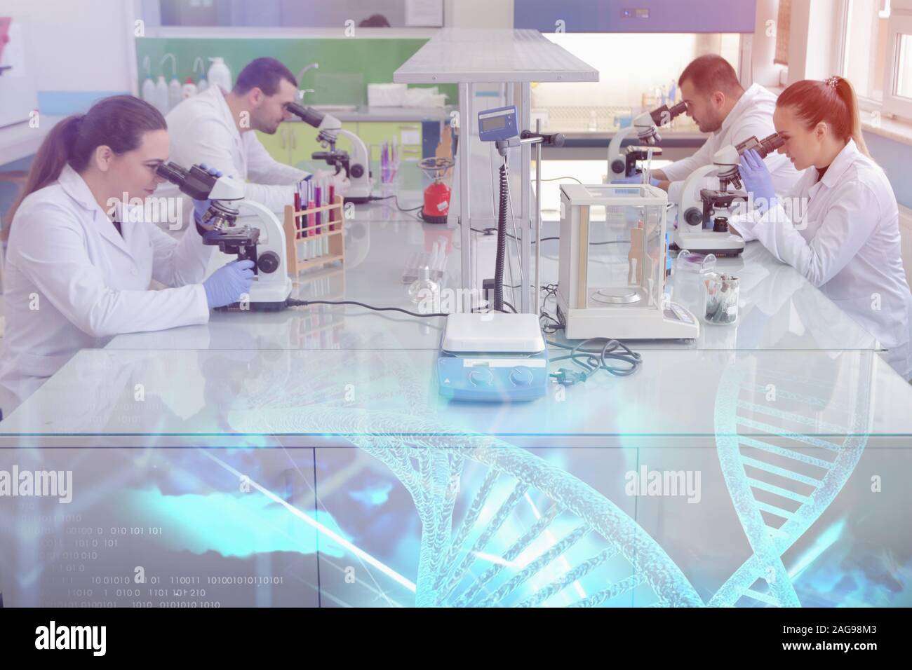 Group of young Laboratory scientists working at lab with test tubes and ...