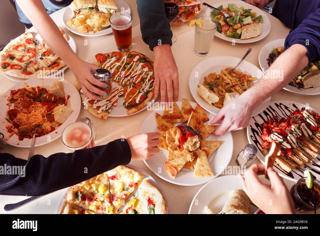 Overhead view of people eating food during a happy hour event Stock ...