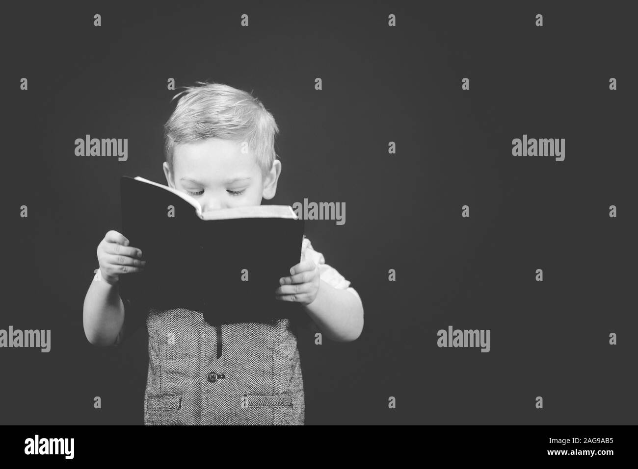 Kid reading bible Black and White Stock Photos & Images - Alamy