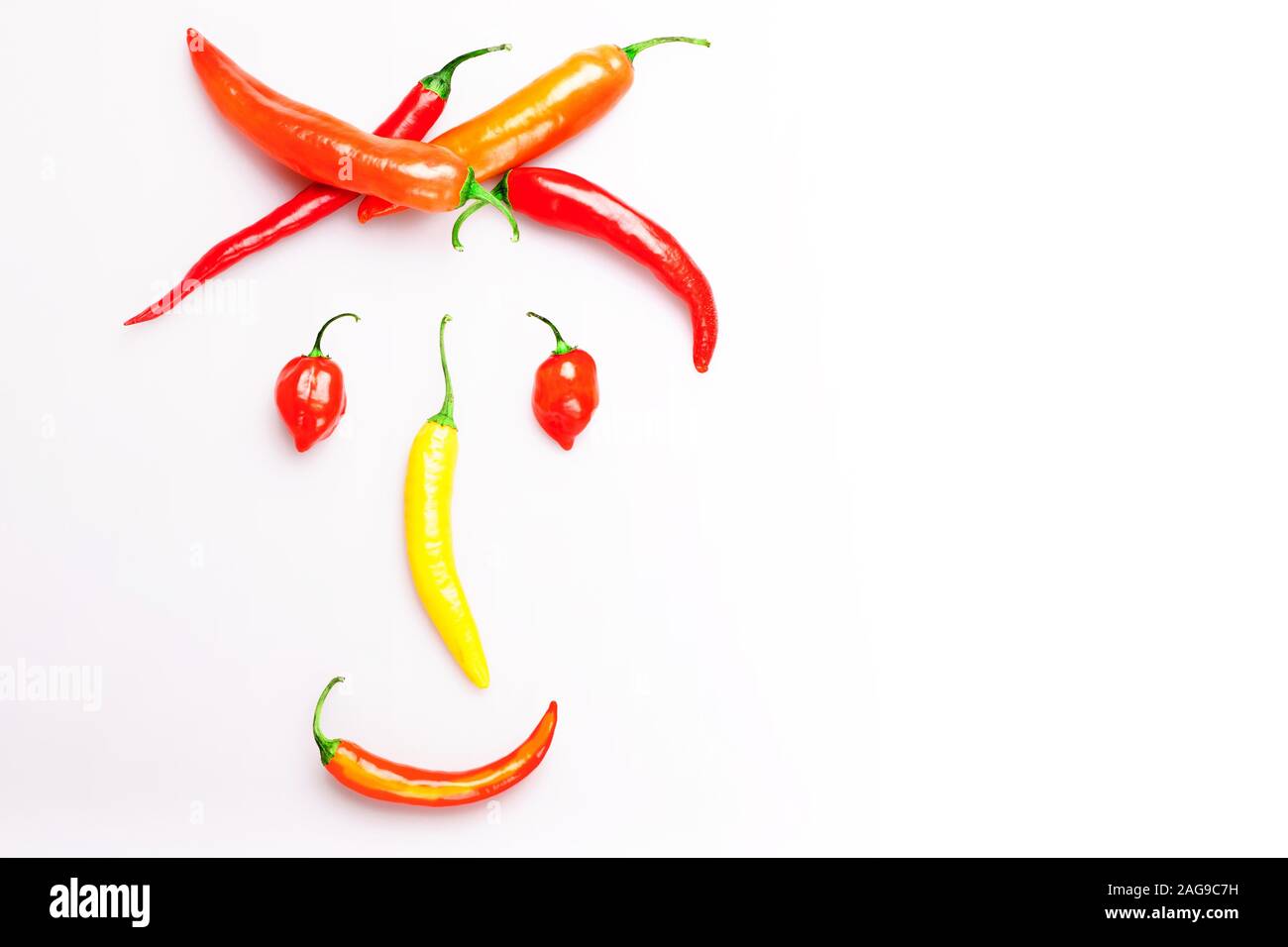 Happy red and yellow chili pepper face smiling, isolated on white ...