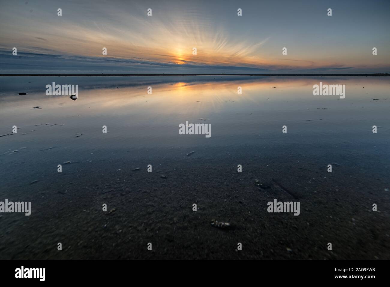 Breathtaking view of the beach and the ocean under the amazing sunset ...