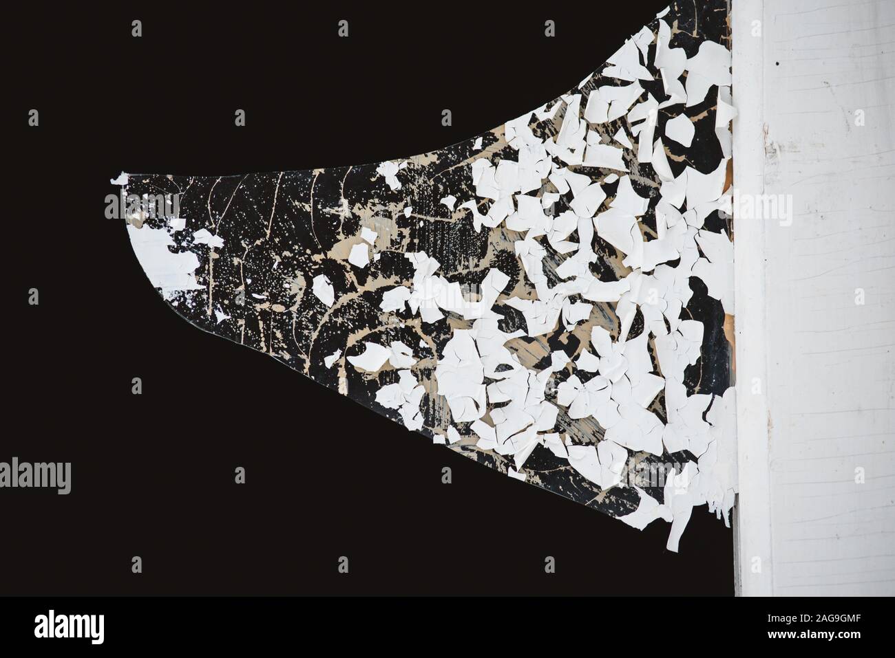 A broken window pane in the doorway, with sharp, dangerous edges of ...