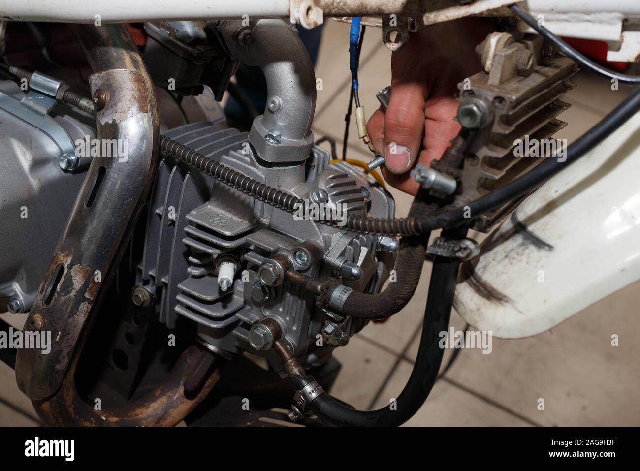 Master dismantles the motorcycle to work on the electric part of the ...