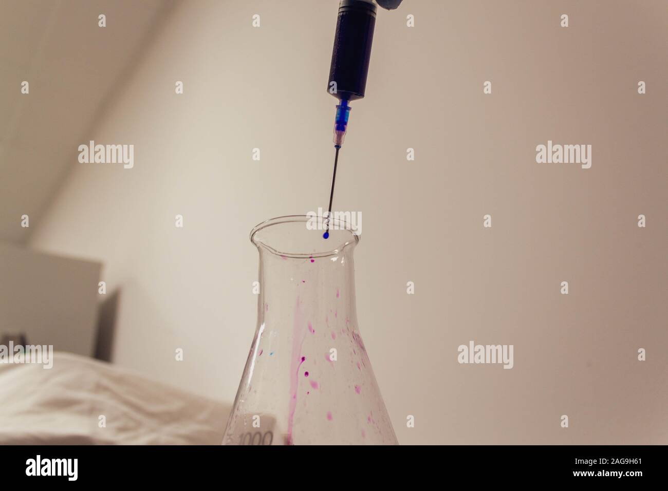 Purple pipette with a glass test tube in the Bristol Robotics ...
