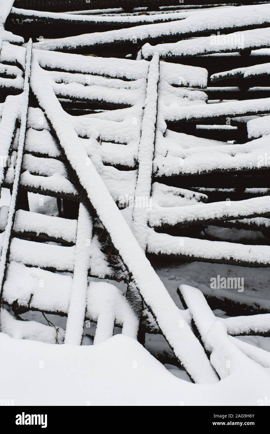 Charred and ruined wooden plank wall covered with snow Stock Photo - Alamy