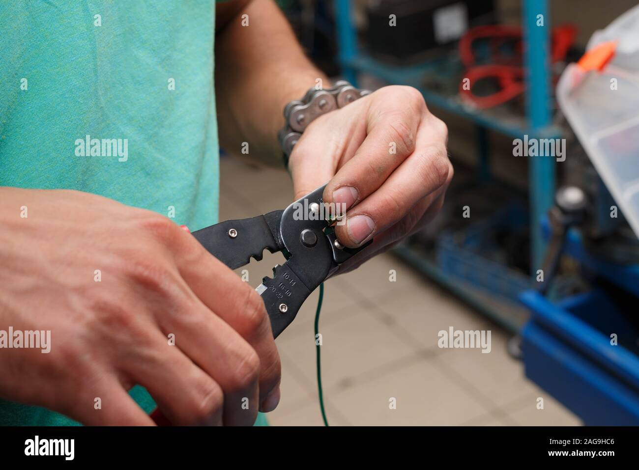 The wizard is preparing a new electrical wire to replace the damaged ...