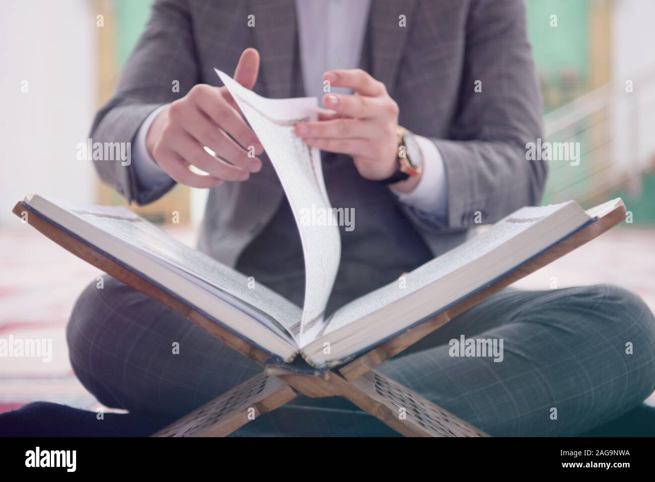 Religious young hafiz muslim man praying inside the mosque and reading ...