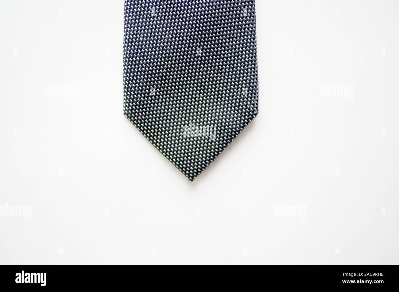 Overhead shot of a black tie on a white surface Stock Photo - Alamy