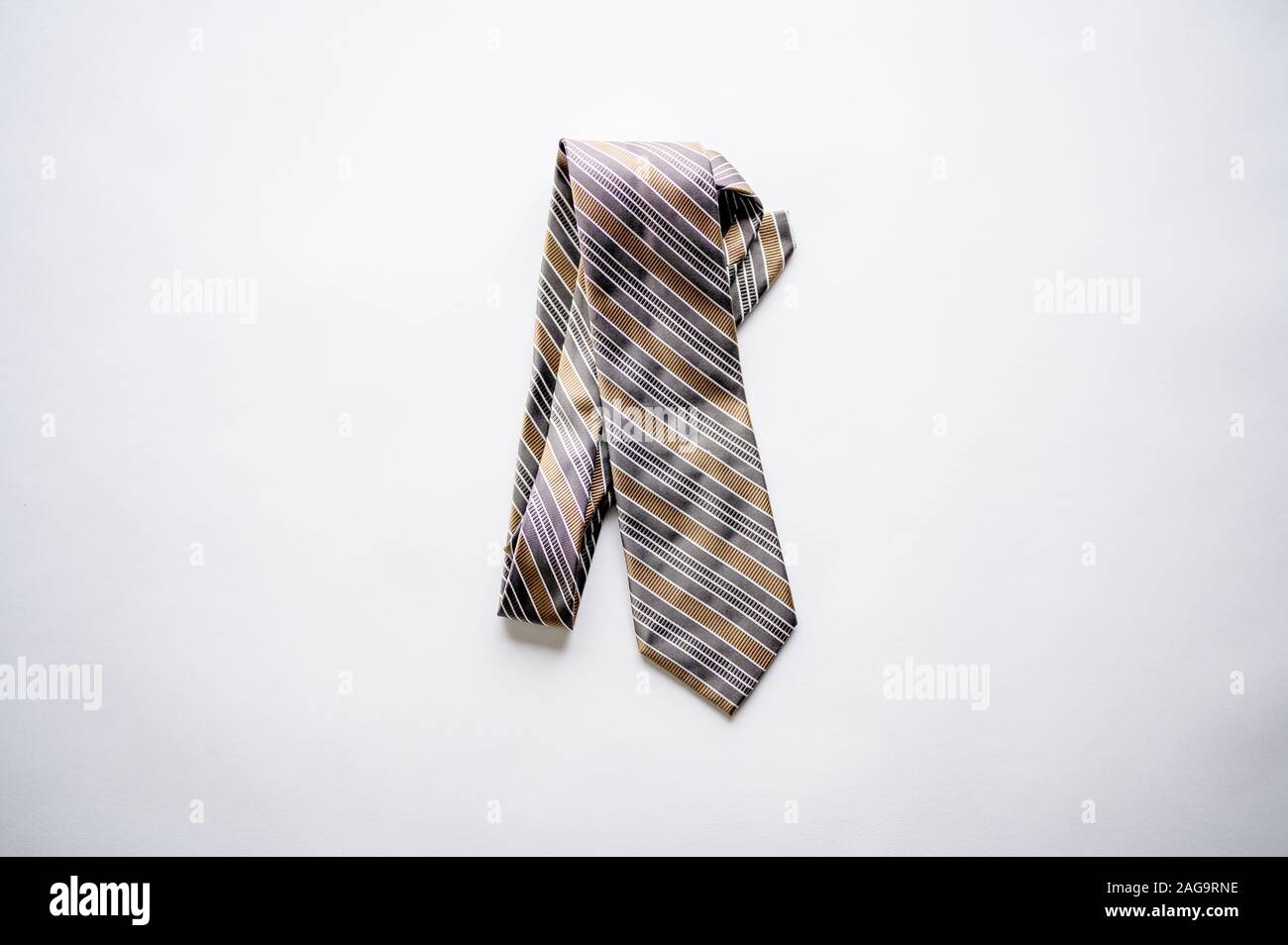 Overhead shot of a folder tie on a white surface Stock Photo - Alamy
