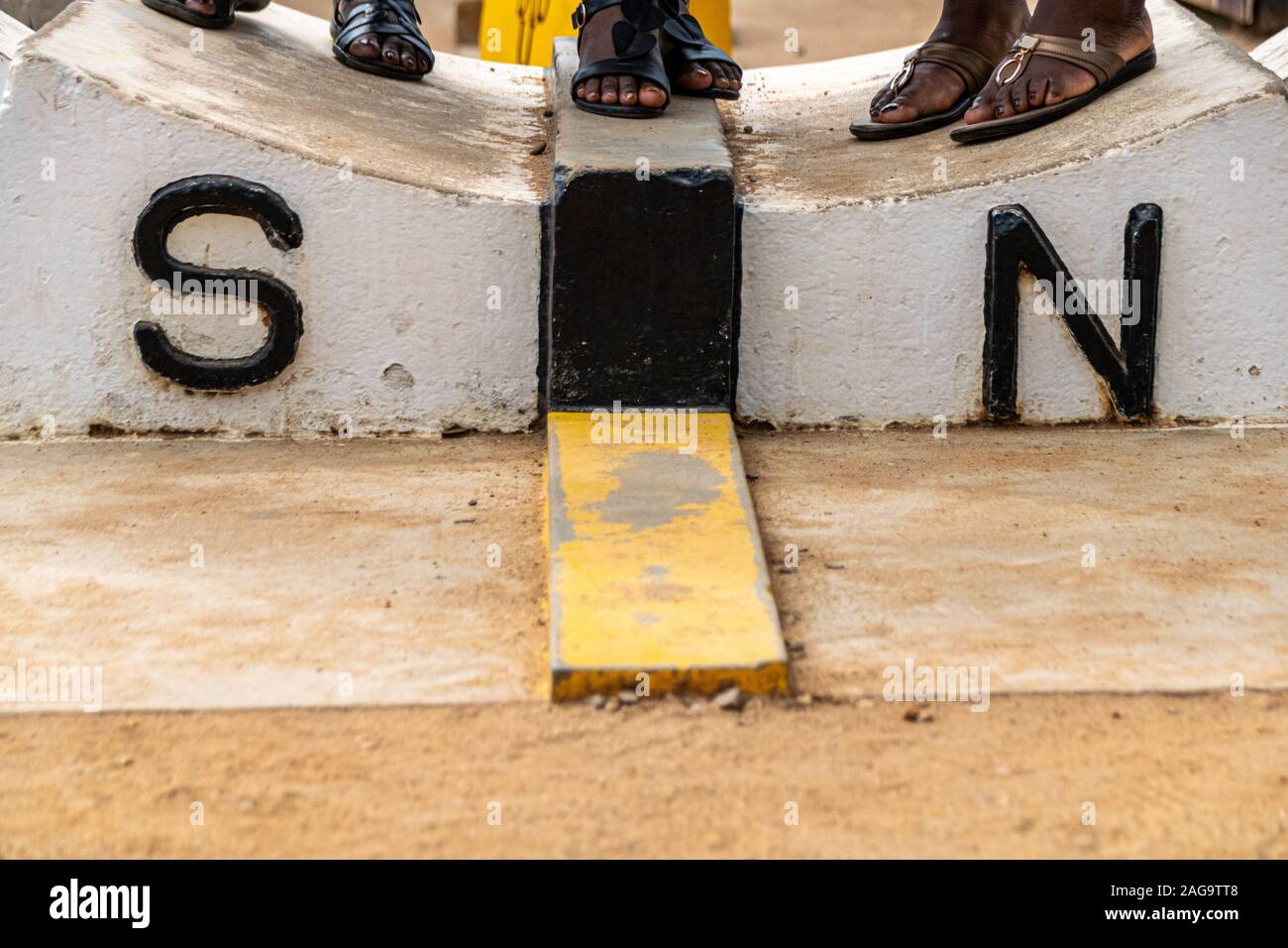 Standing on the centre of the earth at the equator, Kayabwe, Uganda ...