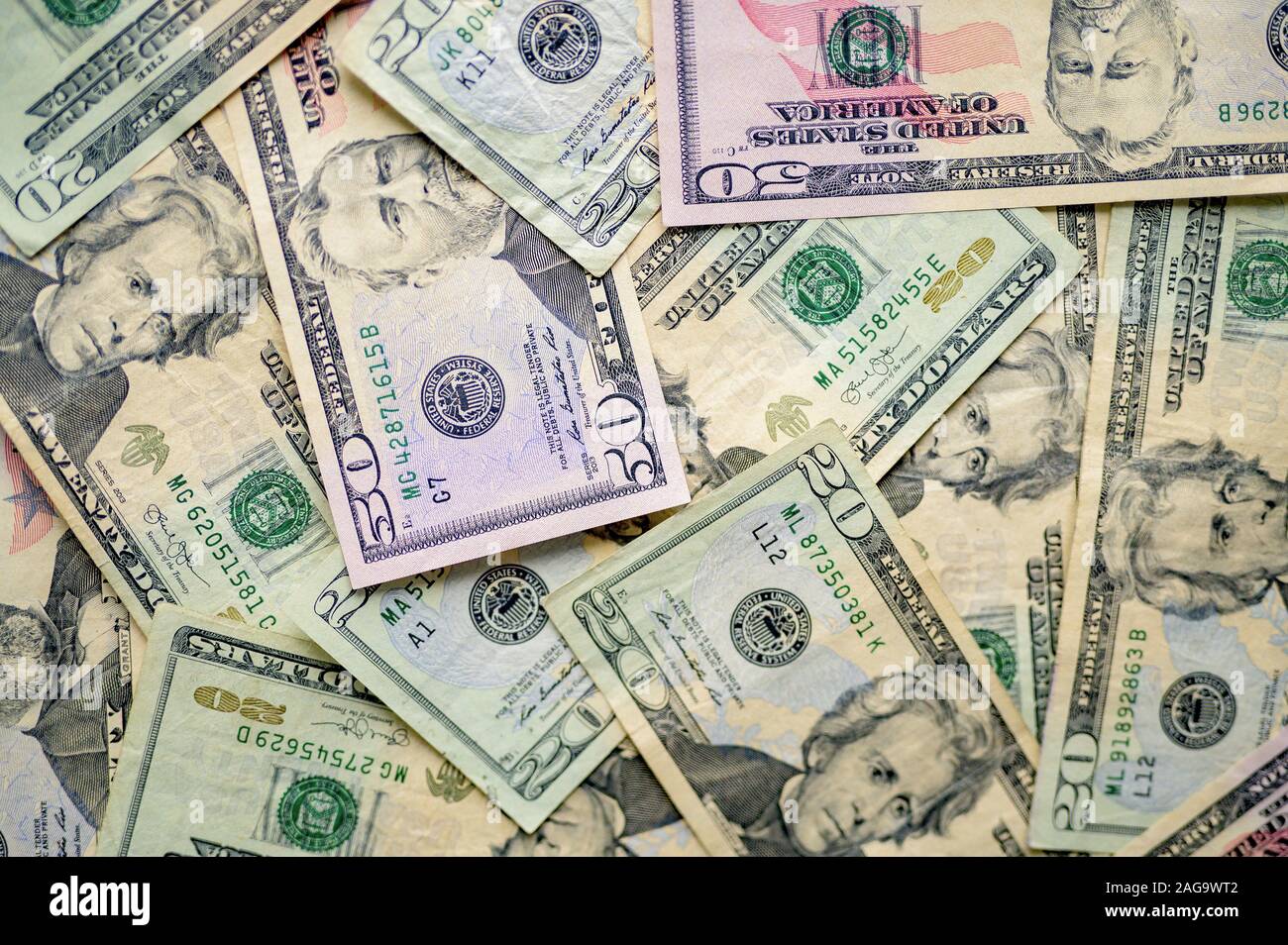 Overhead shot of different types of dollar bills on top of each other ...