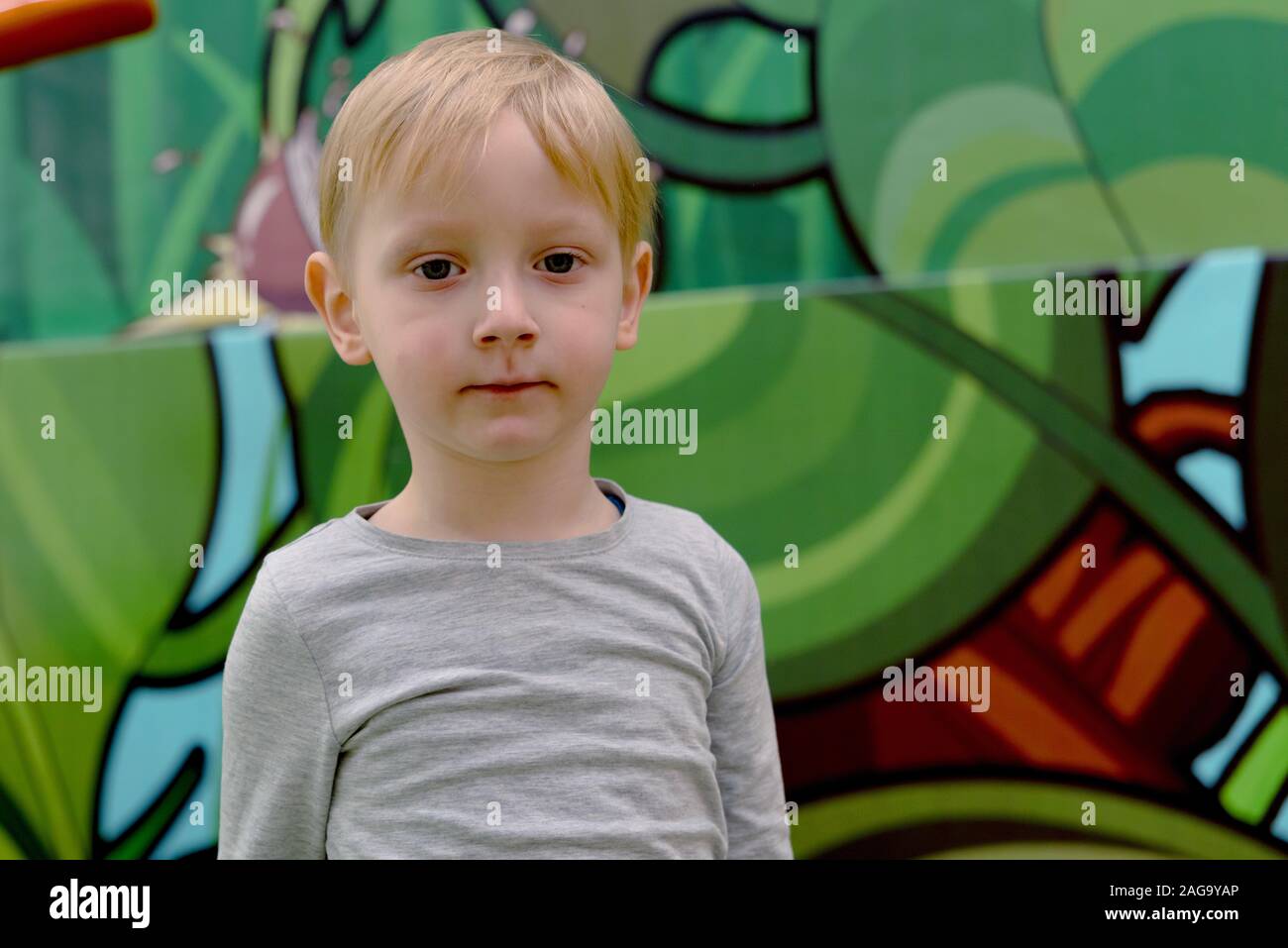 Four year old boy playing at new playground kindergarten. Four years ...