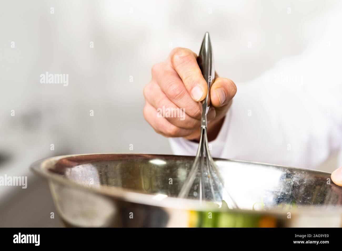 Unrecognizable Chef Man Using Whisk Blending Ingredients In Kitchen ...