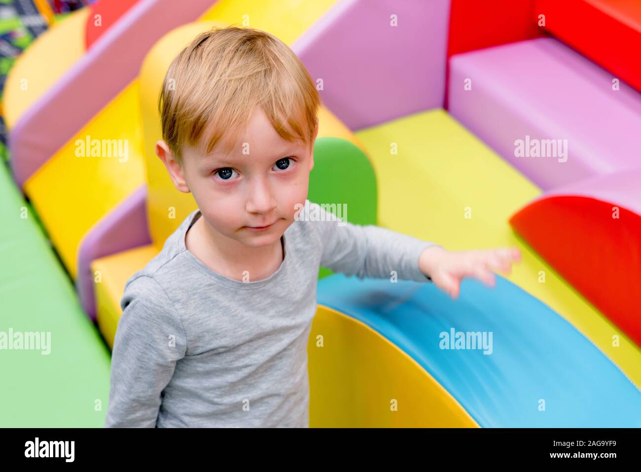 Four year old boy playing at new playground kindergarten. Four years ...