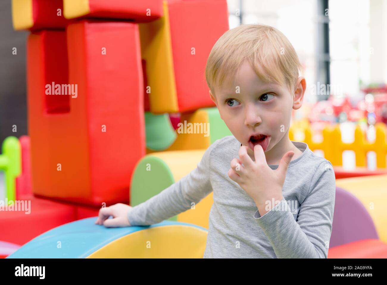 Four year old boy playing at new playground kindergarten. Four years ...