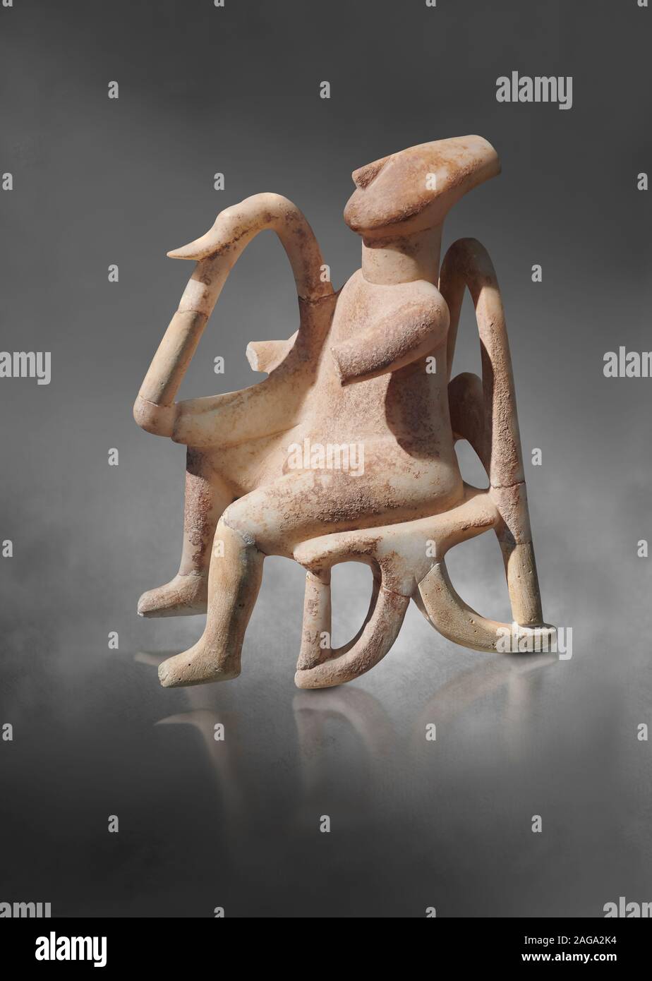 The 'Harpist of Keros' a seated parian marble female Cycladic figurine ...