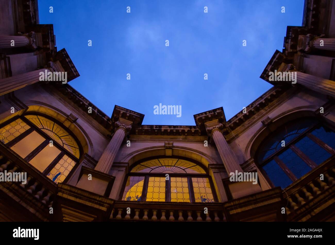 Beautiful low angle shot of a building with arch-shaped windows ...